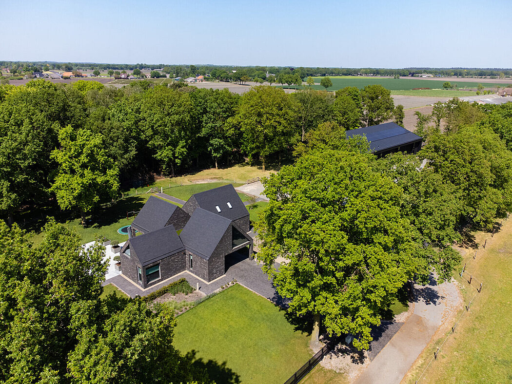 House with Four Roofs: Merging Modern Architecture with Rural Charm